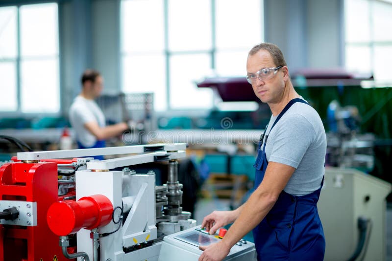 Young worker in factory stock image. Image of business - 47871199