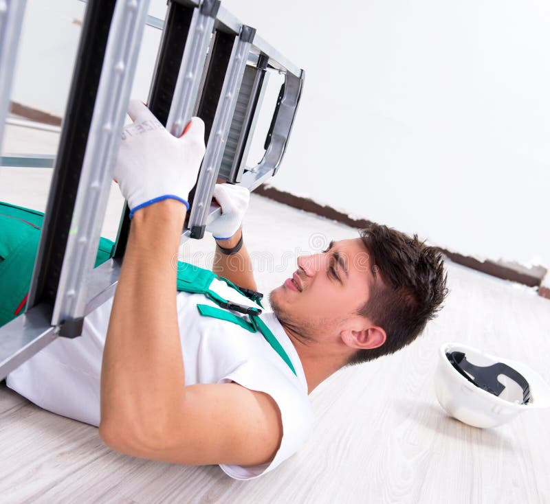 Young Worker Falling from the Ladder Stock Photo - Image of floor ...