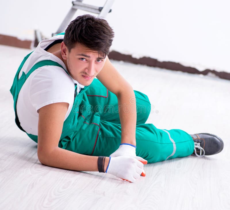 Young Worker Falling from the Ladder Stock Photo - Image of lying ...