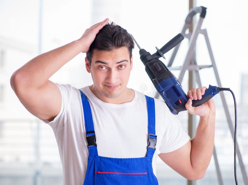 Young Worker with Hand Drill Stock Photo - Image of industrial, driller ...