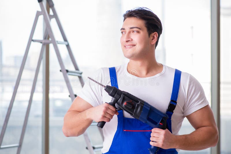 The Young Worker with Hand Drill Stock Photo - Image of foreman ...