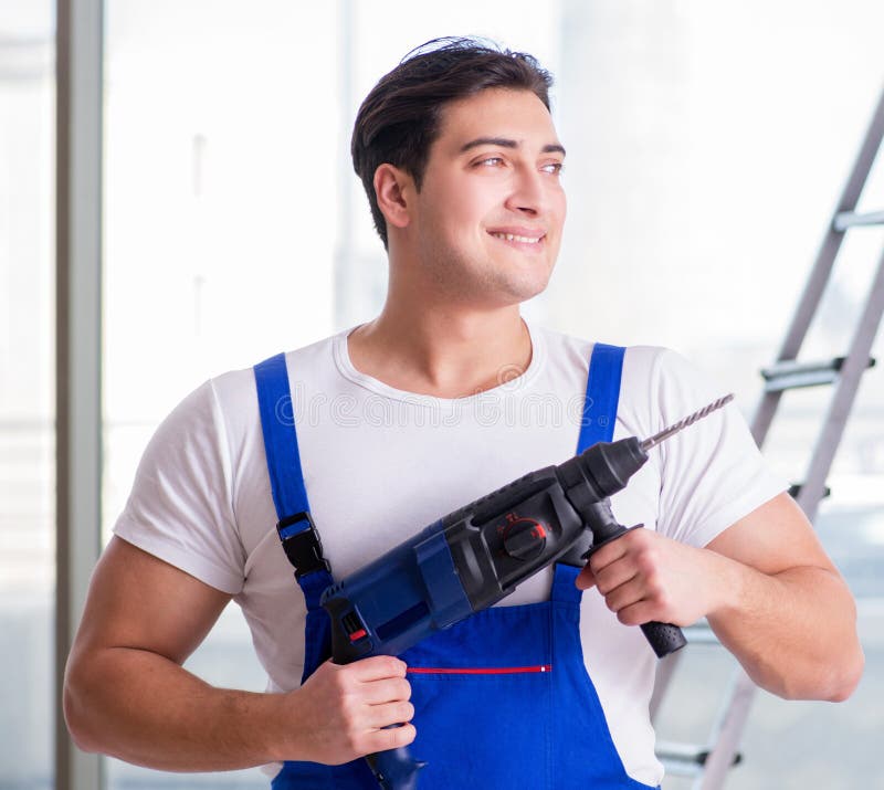 Young Worker with Hand Drill Stock Image - Image of handyman, drilling ...