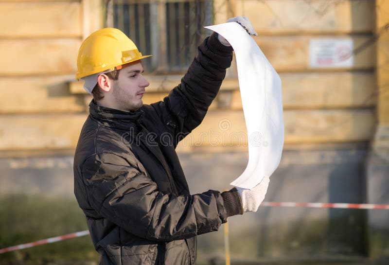 Young Worker Man Looking a Plan Stock Photo - Image of handsome, people ...