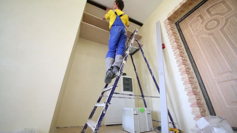 Young Worker Mounts Upper Guide Rail in Sliding Stock Video - Video of ...