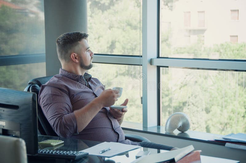 Young Worker in the Office Drinking Coffee, Have Break Time a Stock ...