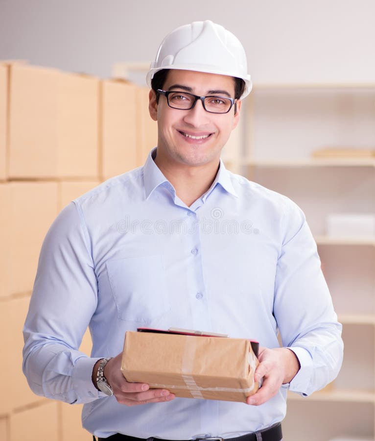 Young Worker in the Postal Office Dealing with Parcels Stock Photo ...