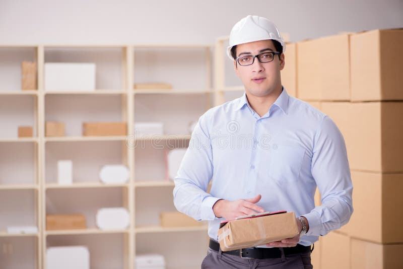 The Young Worker in the Postal Office Dealing with Parcels Stock Photo ...