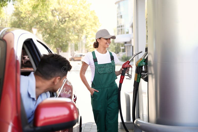 Young Worker Refueling Car at Modern Gas Station Stock Photo - Image of ...