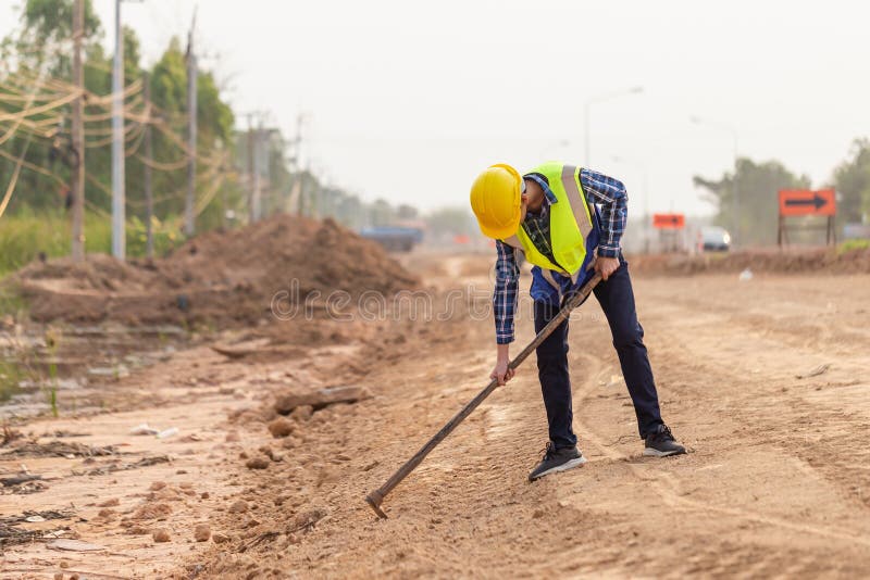 Young Worker at Road Construction Site, Man on a Road Construction ...