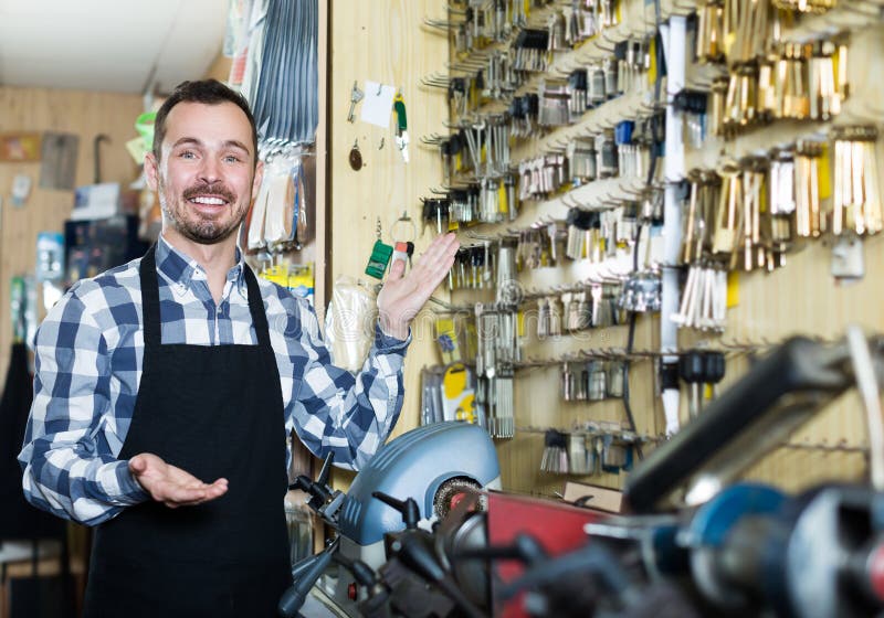 Young Worker Showing His Tools for Making Keys Stock Photo - Image of ...