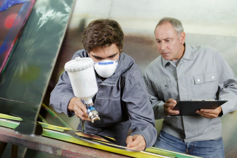 Man Spraying Paint with Air Tool Stock Image - Image of worker ...