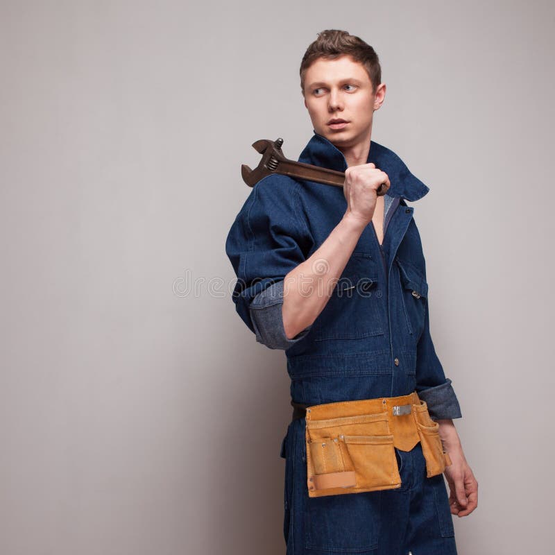 Young Man Worker Employee with Wireless Headphones and Laptop in Front ...