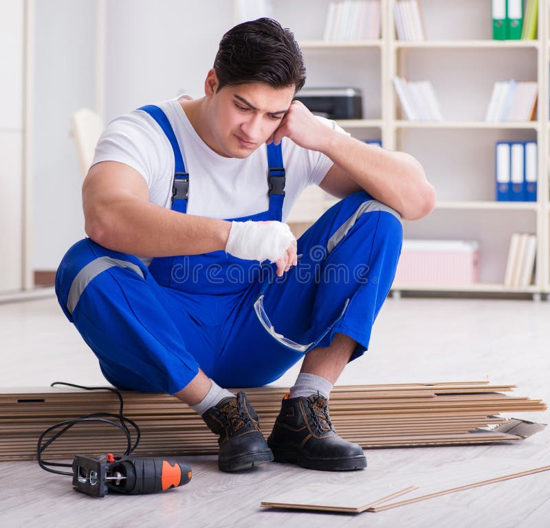 Young Worker Working on Floor Laminate Tiles Stock Photo - Image of ...