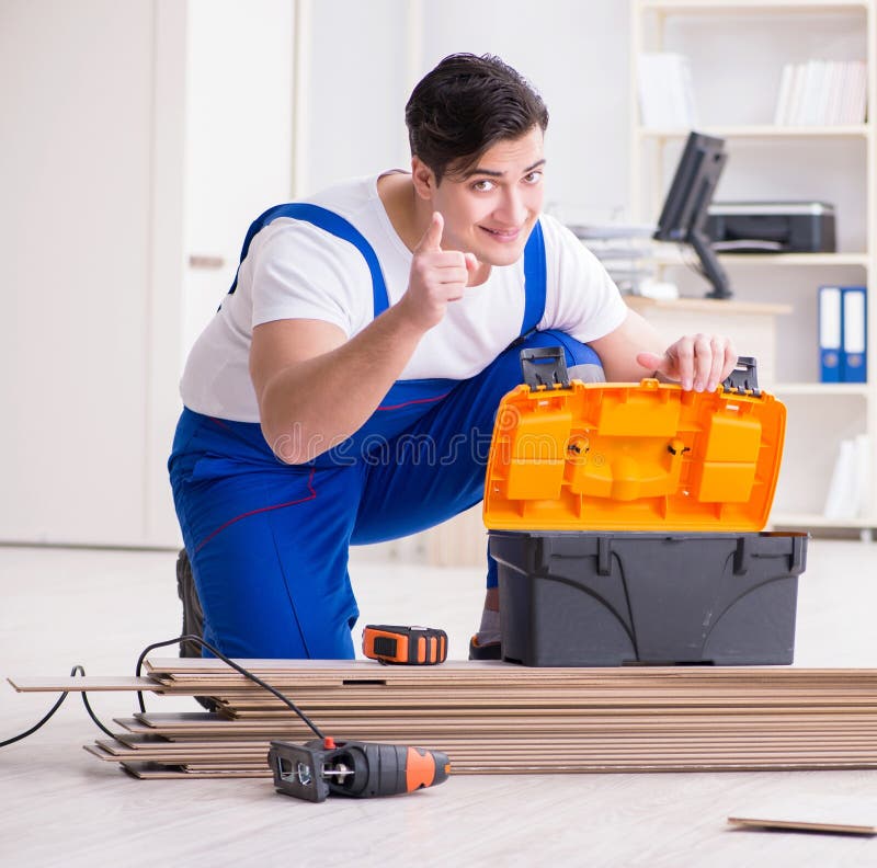Young Worker Working on Floor Laminate Tiles Stock Image - Image of ...