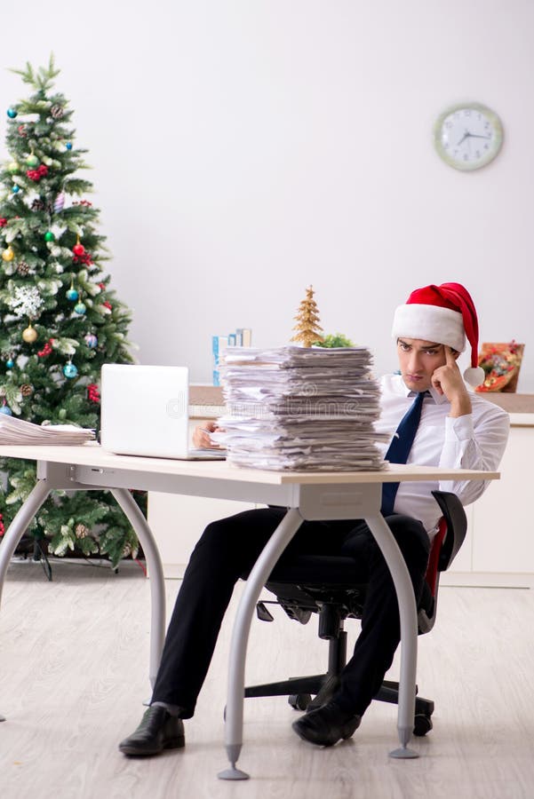 The Young Worker Working in Office on Christmas Shift Stock Image ...