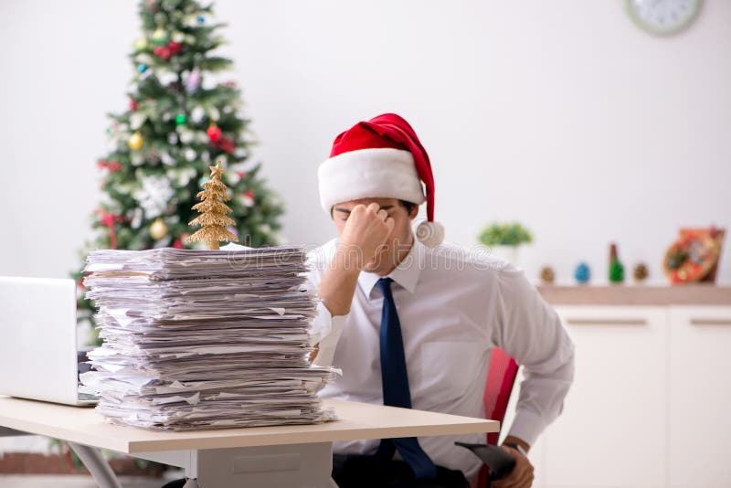 The Young Worker Working in Office on Christmas Shift Stock Image ...