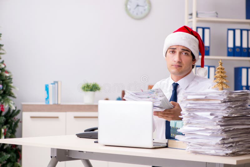 The Young Worker Working in Office on Christmas Shift Stock Image ...
