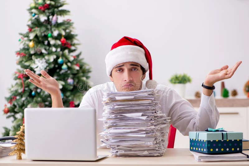 The Young Worker Working in Office on Christmas Shift Stock Image ...