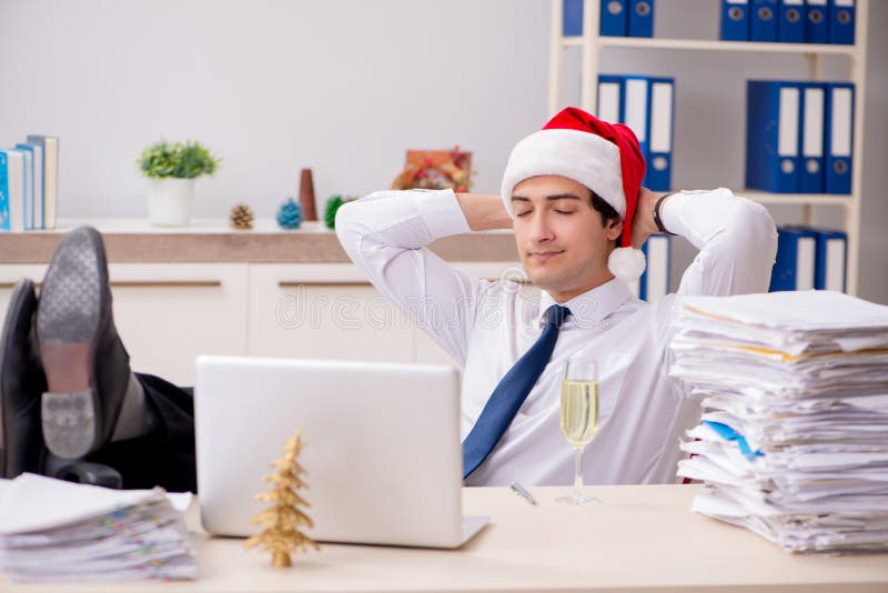 The Young Worker Working in Office on Christmas Shift Stock Image ...