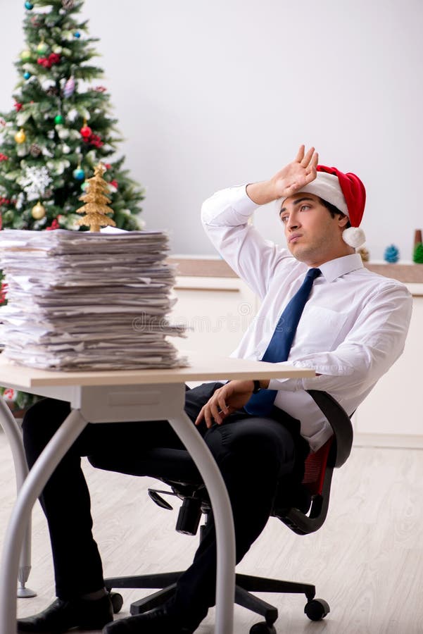 The Young Worker Working in Office on Christmas Shift Stock Image ...