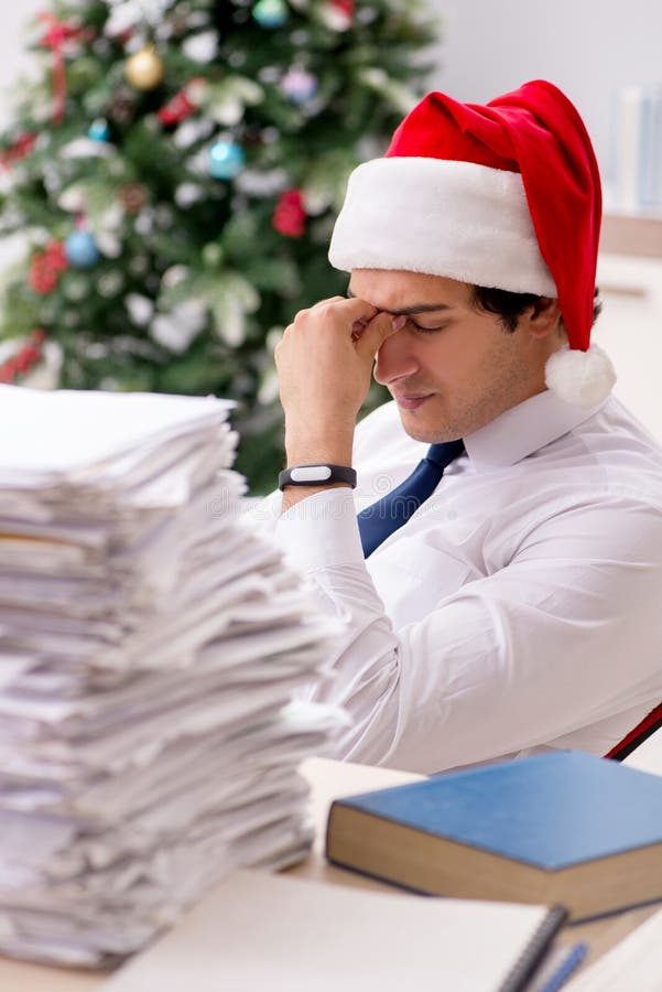 The Young Worker Working in Office on Christmas Shift Stock Photo ...