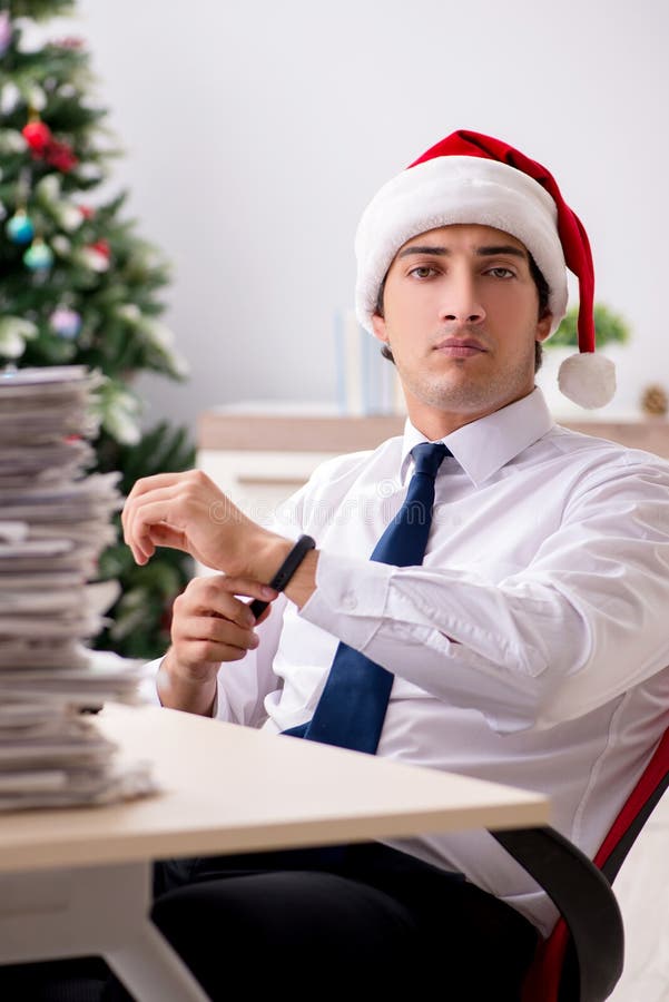 The Young Worker Working in Office on Christmas Shift Stock Photo ...
