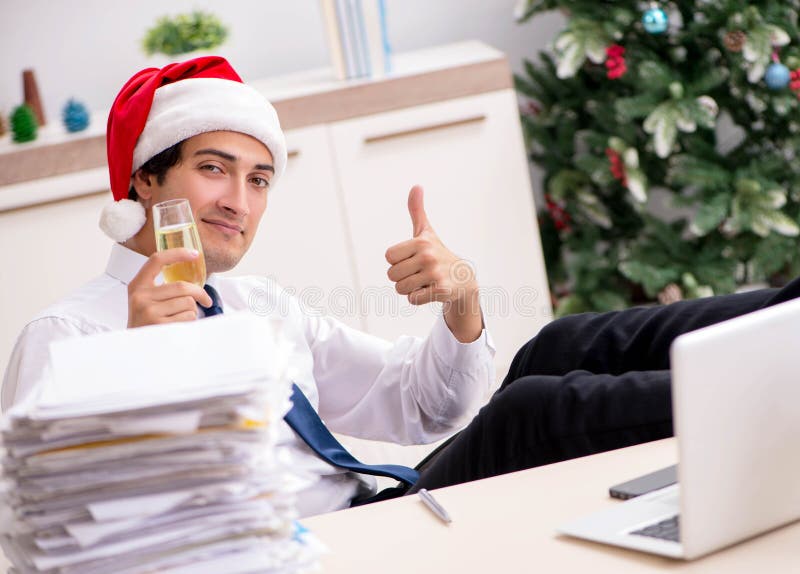 Young Worker Working in Office on Christmas Shift Stock Photo - Image ...