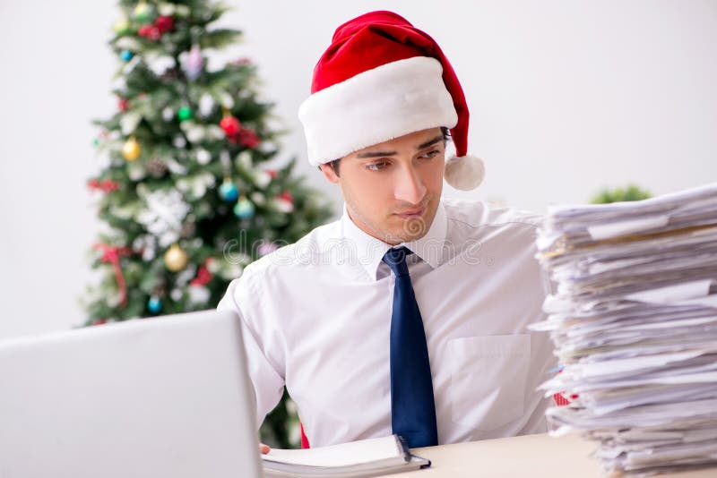 The Young Worker Working in Office on Christmas Shift Stock Image ...
