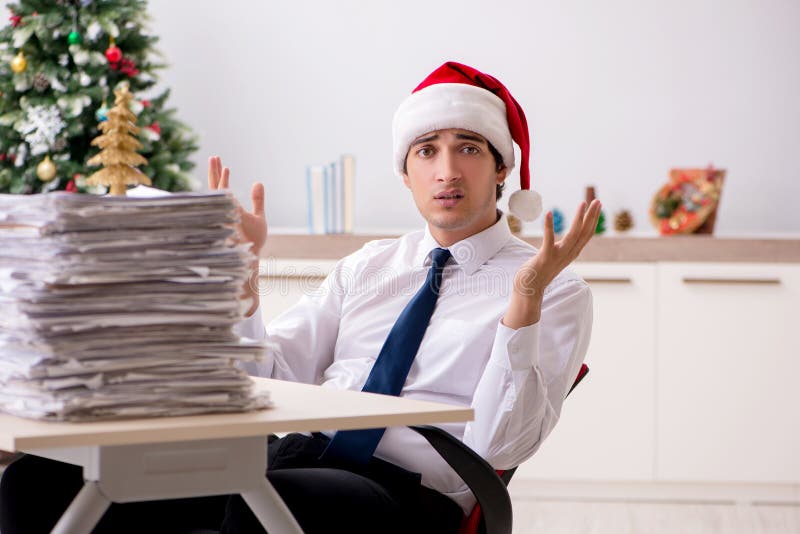 The Young Worker Working in Office on Christmas Shift Stock Image ...