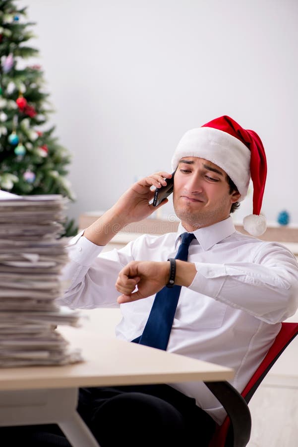 The Young Worker Working in Office on Christmas Shift Stock Photo ...