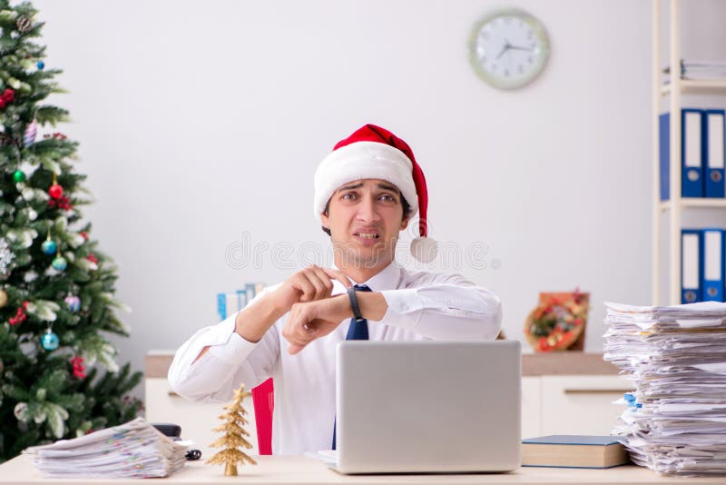 The Young Worker Working in Office on Christmas Shift Stock Photo ...