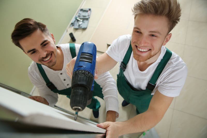 Young Workers Installing Drywall, Above View. Home Repair Service Stock ...