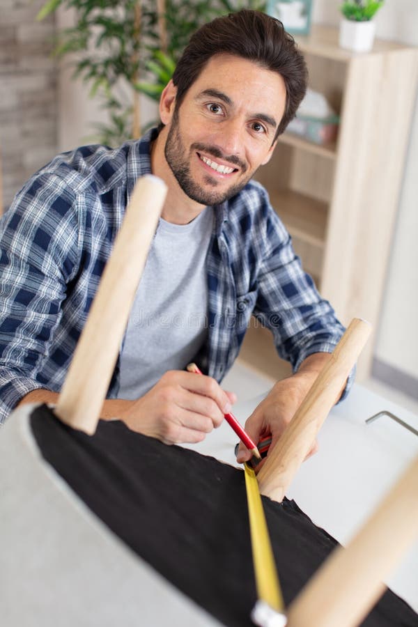 Young Working Man Repairing Chair at Home Stock Photo - Image of ...