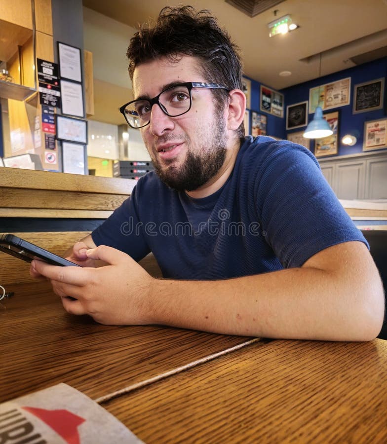 Youngman Talking and Typing a Message at the Same Time Stock Photo ...