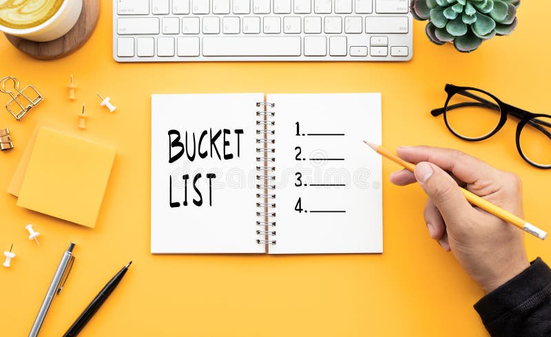 Youngman Writing Bucket List on Notepad Stock Photo - Image of ...