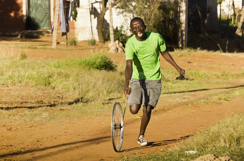 Youngster Playing with Wheel Rim Stock Image - Image of relax ...
