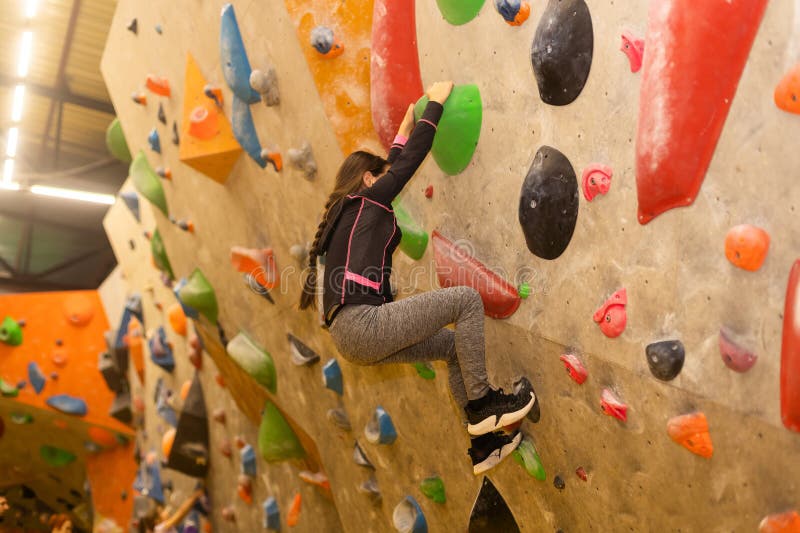 Youngster S Effort in Climbing a Wall To Reach the Top. Stock Image ...