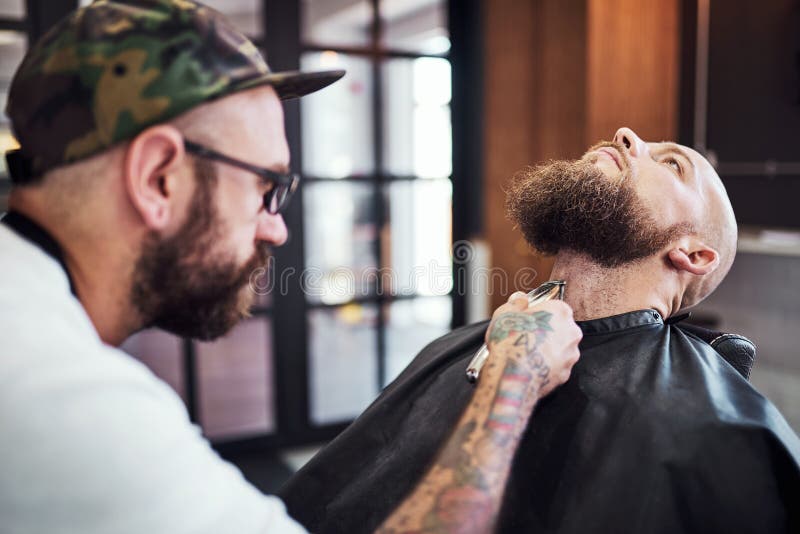 Your Beard is in Safe Hands with Me. a Handsome Young Barber Trimming ...