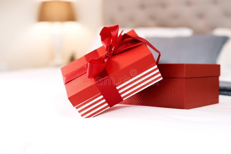 Your Surprise is Waiting for You. a Gift Box on a Bed at Home. Stock ...