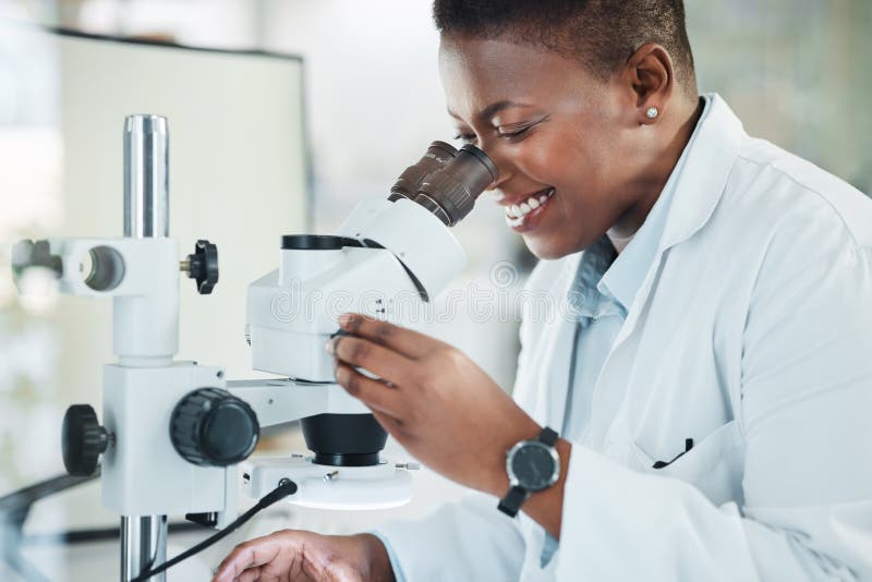 Your Test Results are Ready. a Young Woman Using a Microscope in a Lab ...