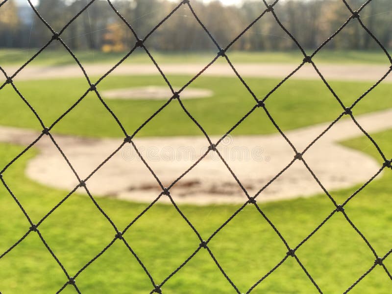 Youth Baseball Field Viewed from Behind Net Stock Photo - Image of ...