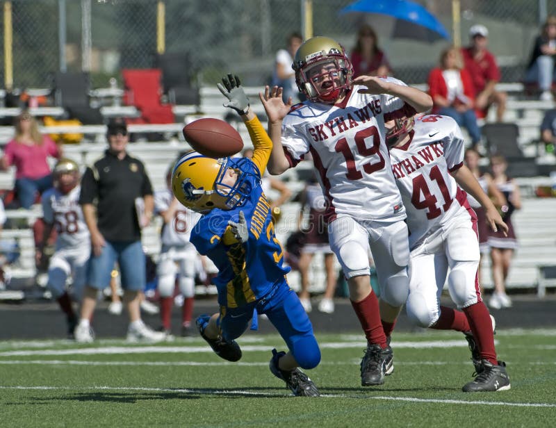 Youth football fumble 1 editorial stock photo. Image of ball - 6536738