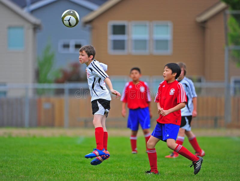 Youth Soccer Jump for a Head Ball Editorial Photo - Image of oregon ...