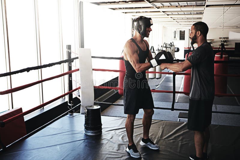 Youve Got this. a Man Training in the Boxing Ring with a Coach. Stock ...