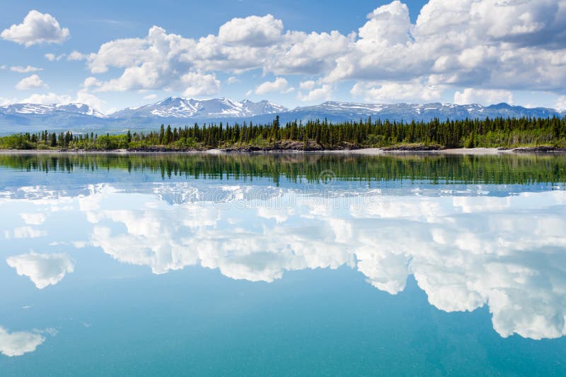 Yukon Wilderness Cloudscape Reflected on Calm Lake Stock Photo - Image ...