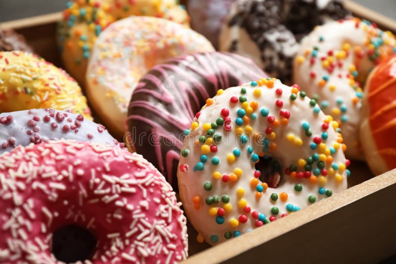 Yummy Donuts with Sprinkles in Box, Closeup Stock Photo - Image of ...