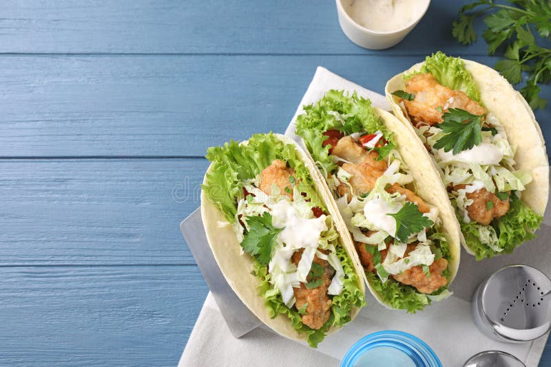 Yummy Fish Tacos Served on Blue Table, Flat Lay. Space for Text Stock ...