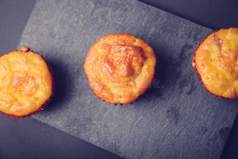 Yummy muffins in a row stock photo. Image of yellow - 109779390