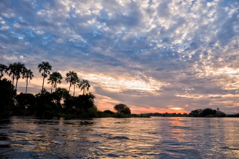 The Zambeze River at Sunset Stock Image - Image of trees, water: 57225987
