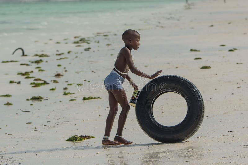 Kids Playing with Simple Things on Zanzibar. Tanzania Editorial Stock ...